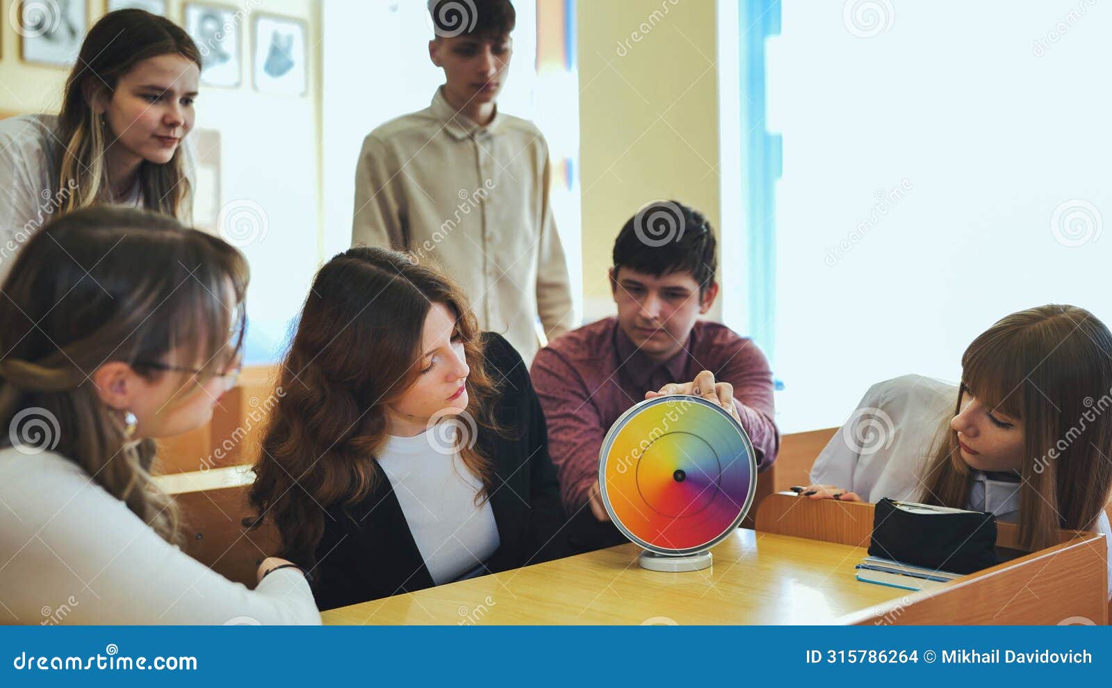 Students in Physics Class Spin Newton S Multicolored Disk. Stock Photo ...