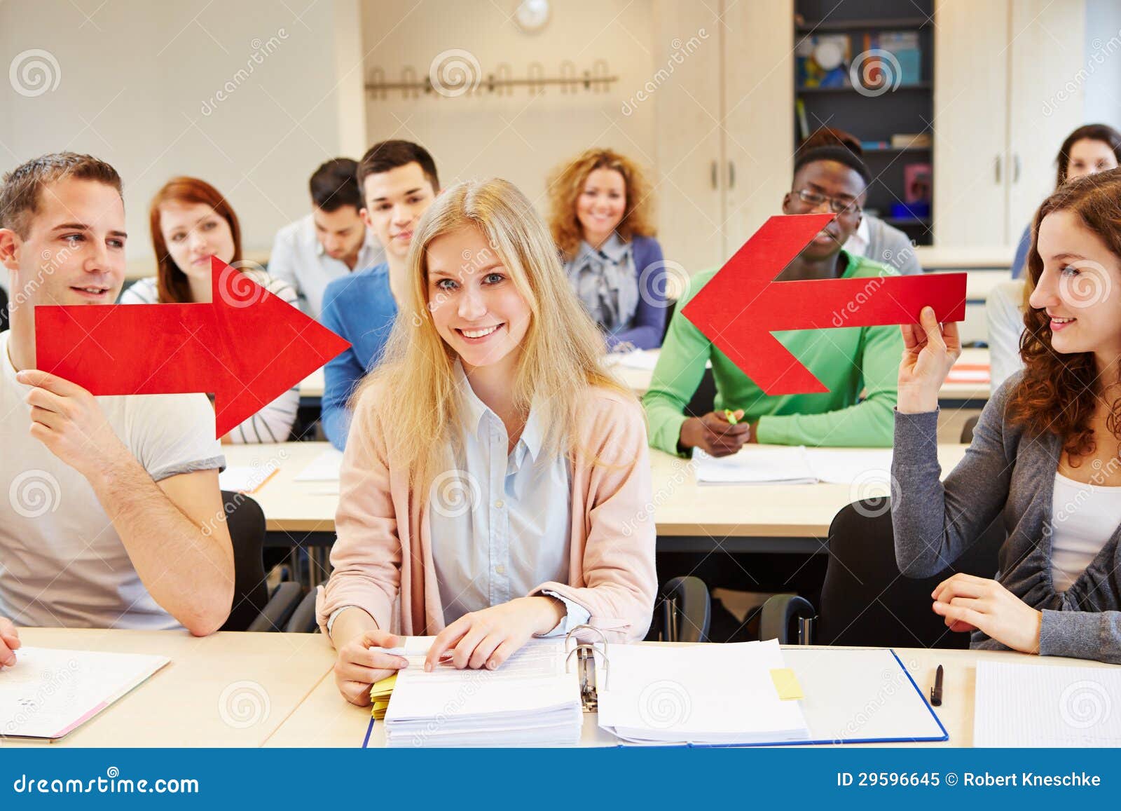 Students Pointing Arrows To Student Stock Image - Image of happy ...