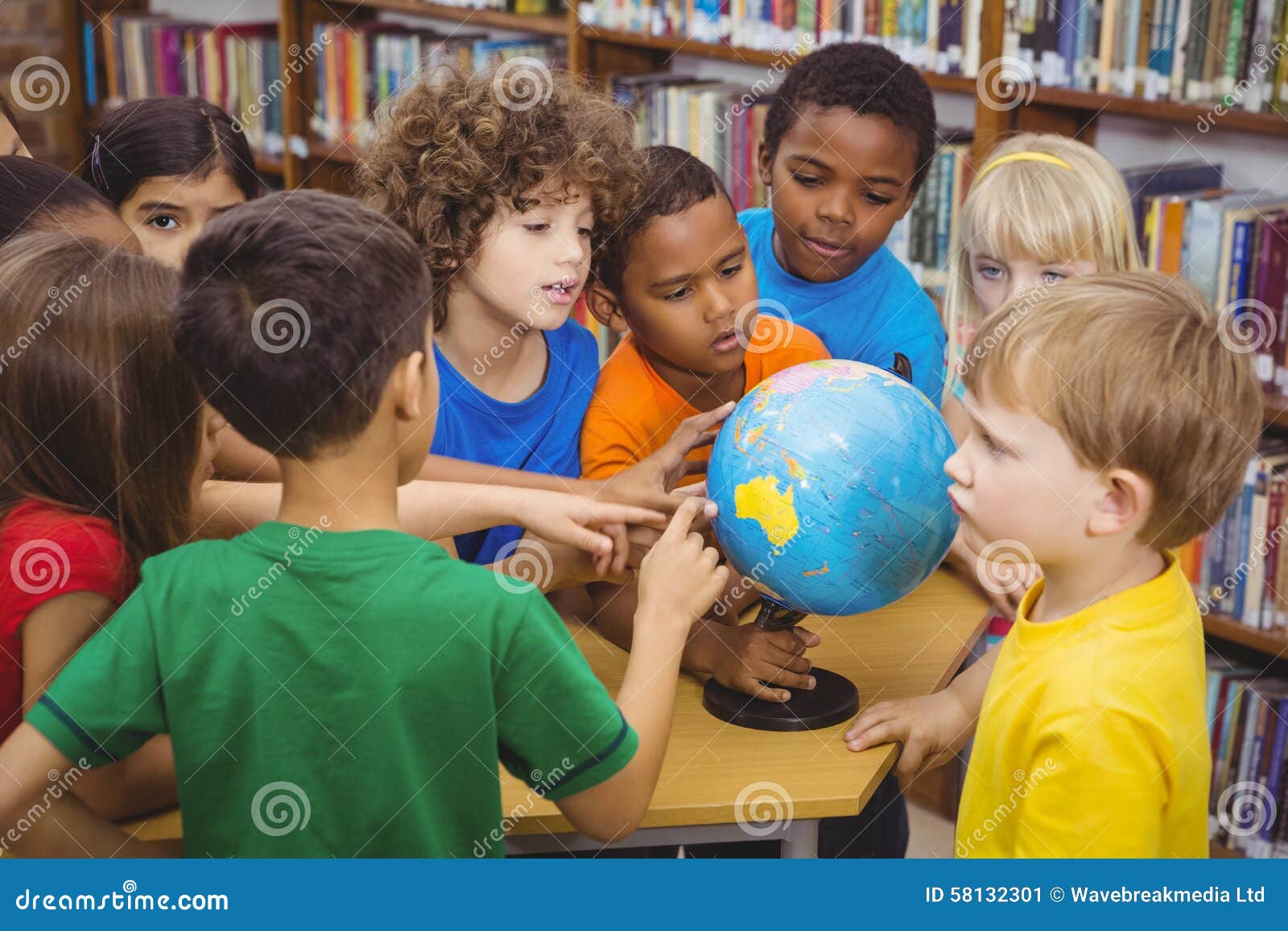 Students Pointing at a Globe Stock Image - Image of lesson, education ...