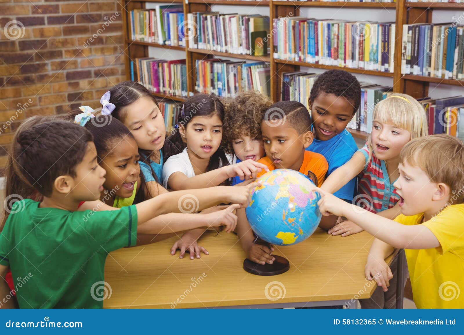 Students Pointing at a Globe Stock Image - Image of classroom, early ...