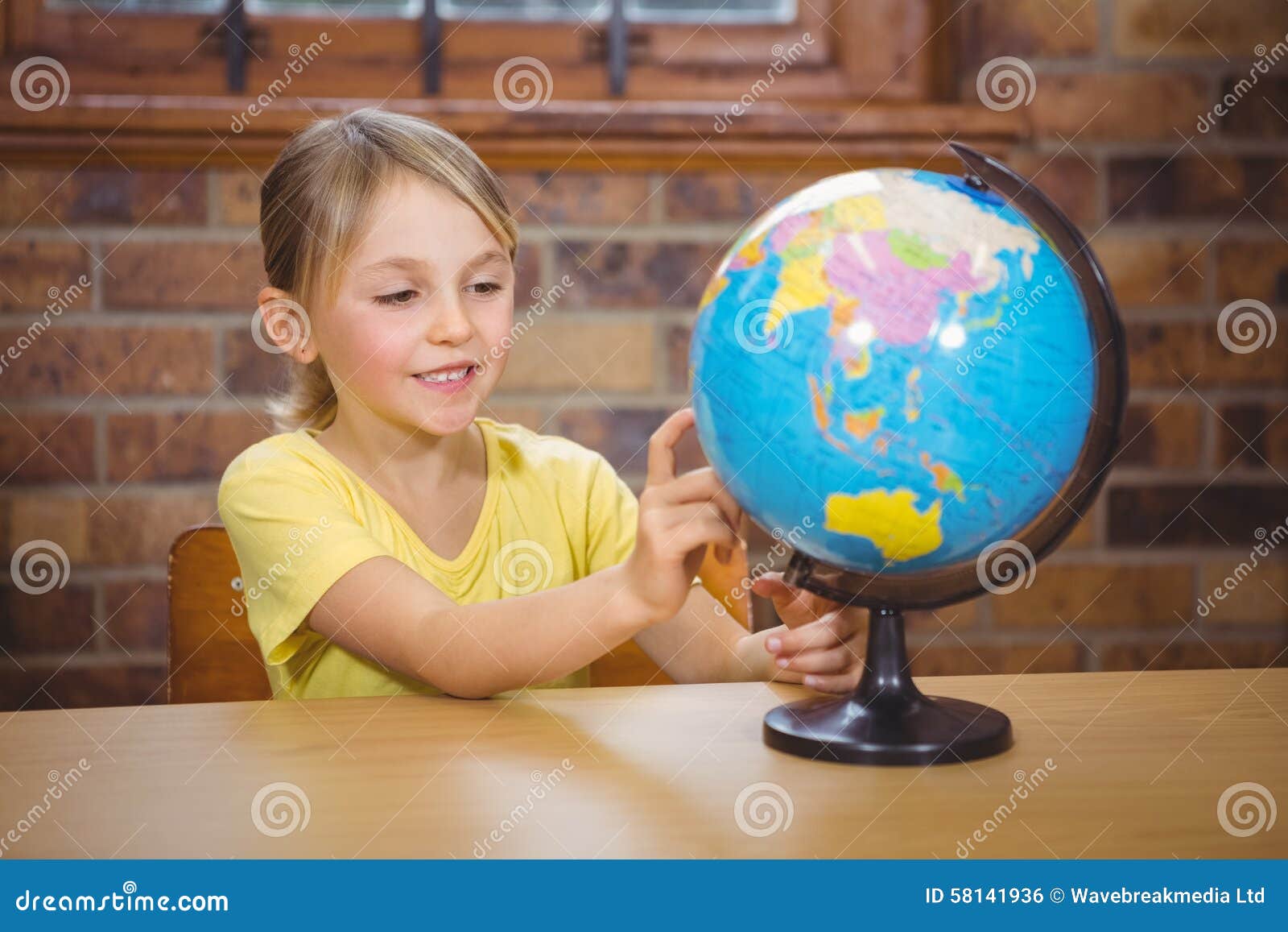 Students Pointing at a Globe Stock Photo - Image of learn, childhood ...