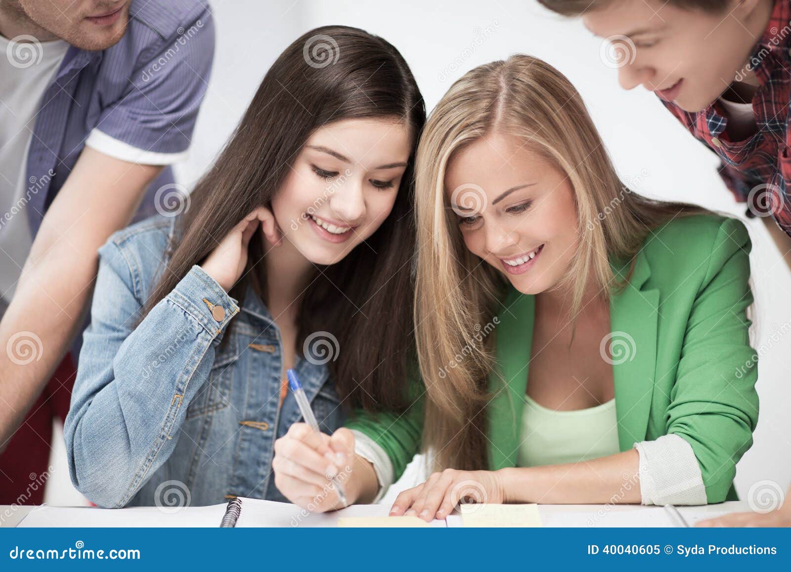 Students Pointing at Notebook at School Stock Image - Image of library ...
