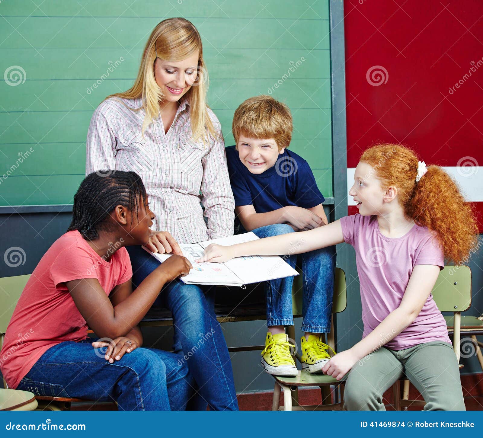 Students Pointing To Notebook Stock Photo - Image of class, book: 41469874