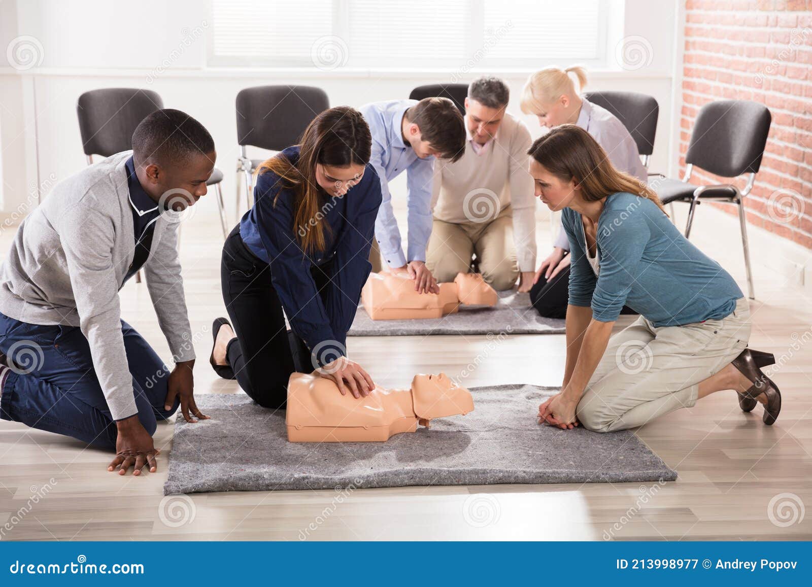 Students Practicing CPR Chest Compression on Dummy Stock Image - Image ...