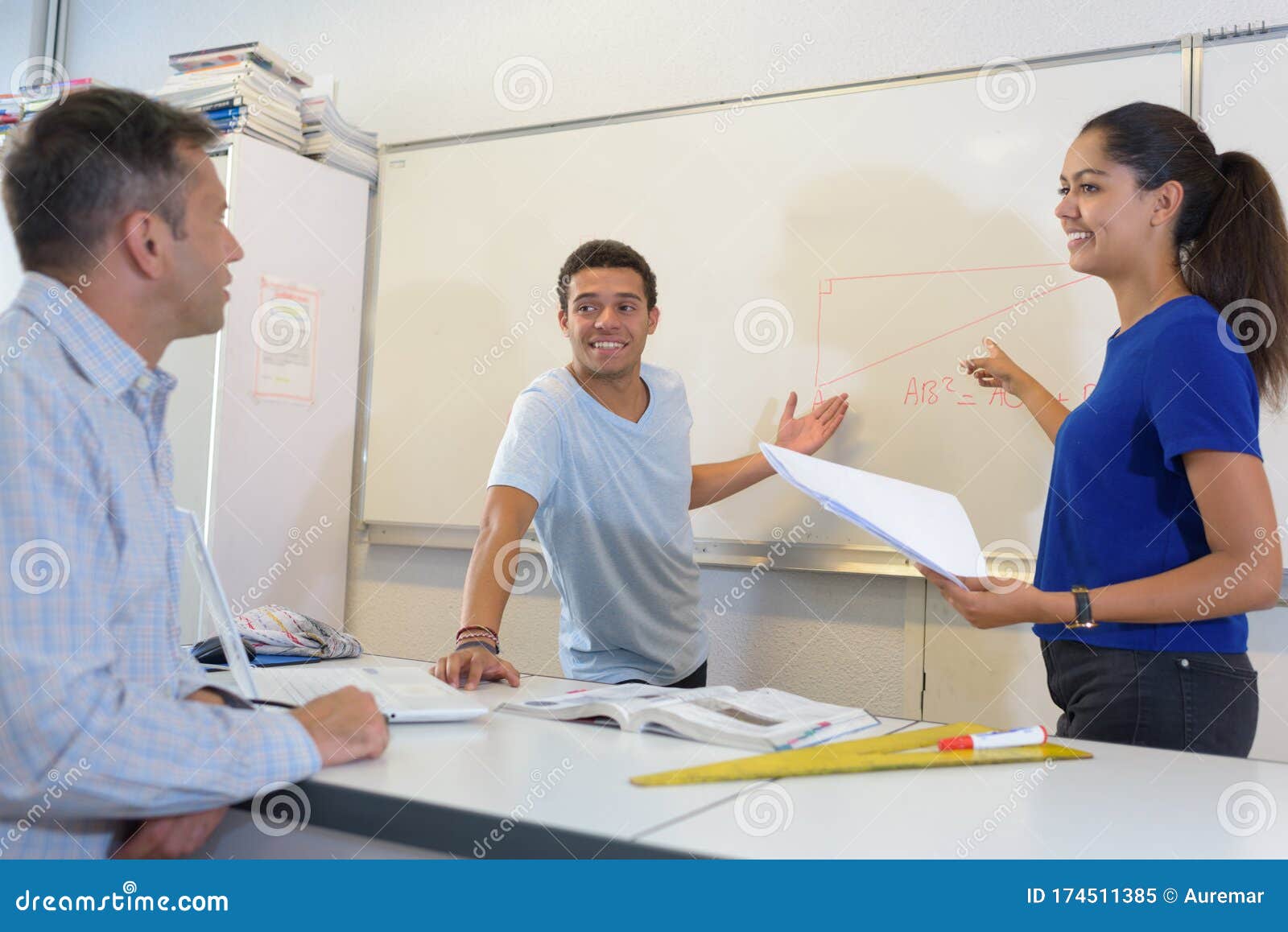 Students Presenting Answer on Whiteboard To Geometry Teacher Stock ...