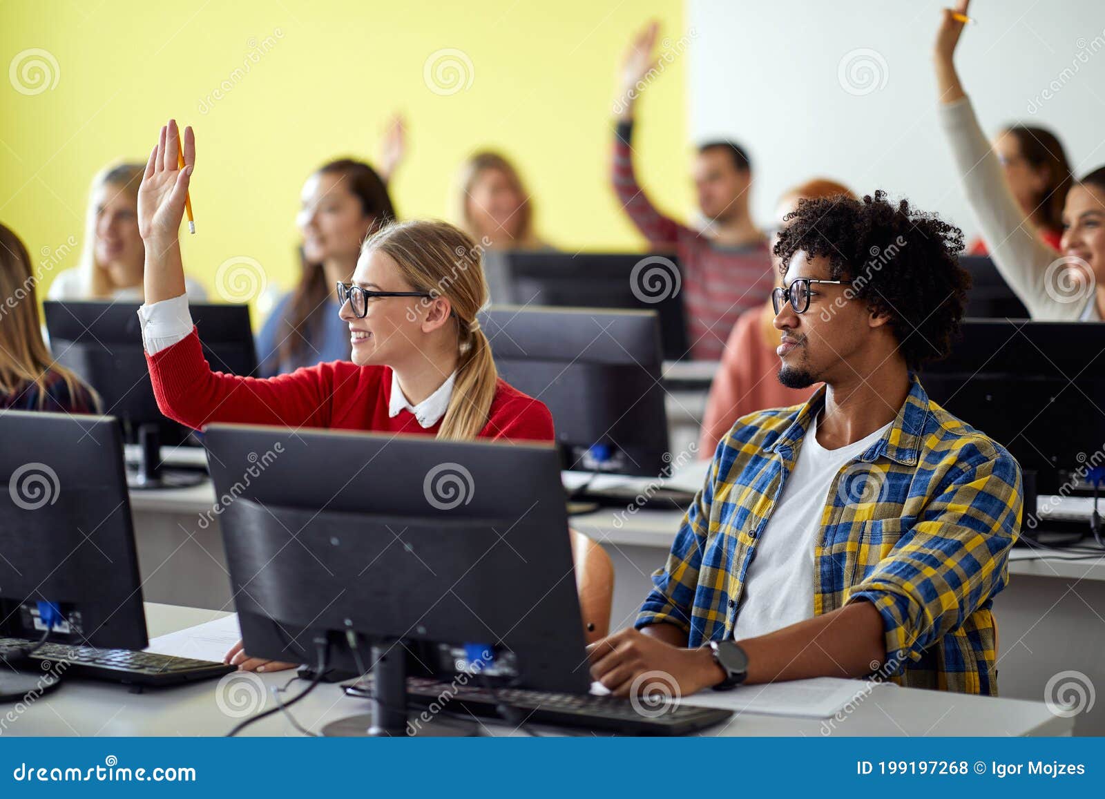 Students Raising Hands for an Answer on Professor Question at an ...
