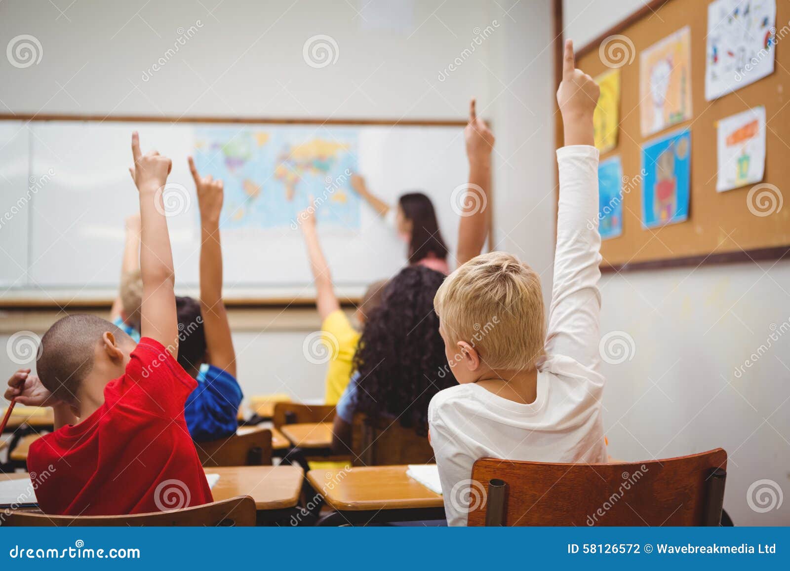 Students Raising Hands To Answer a Question Stock Photo - Image of ...