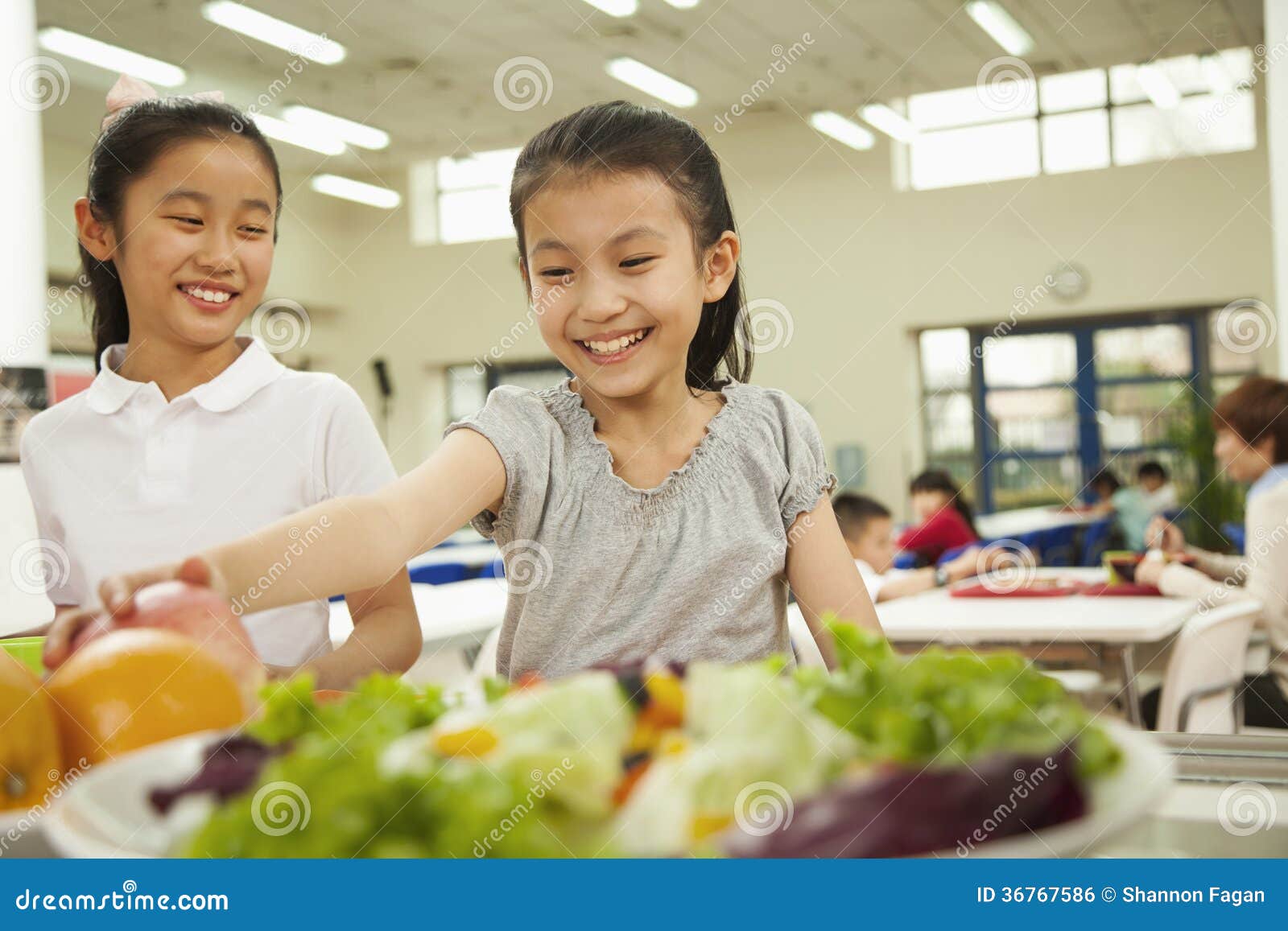 Students Reaching for Healthy Food in School Cafeteria Stock Photo ...