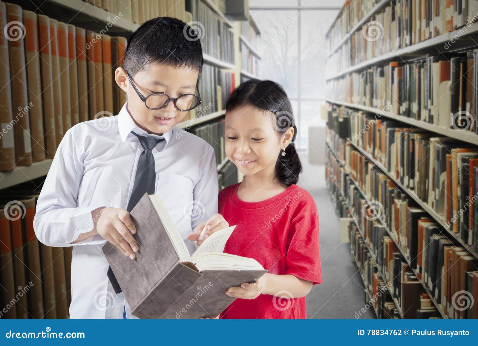 Students Read Books in Library Aisle Stock Photo - Image of indonesian ...