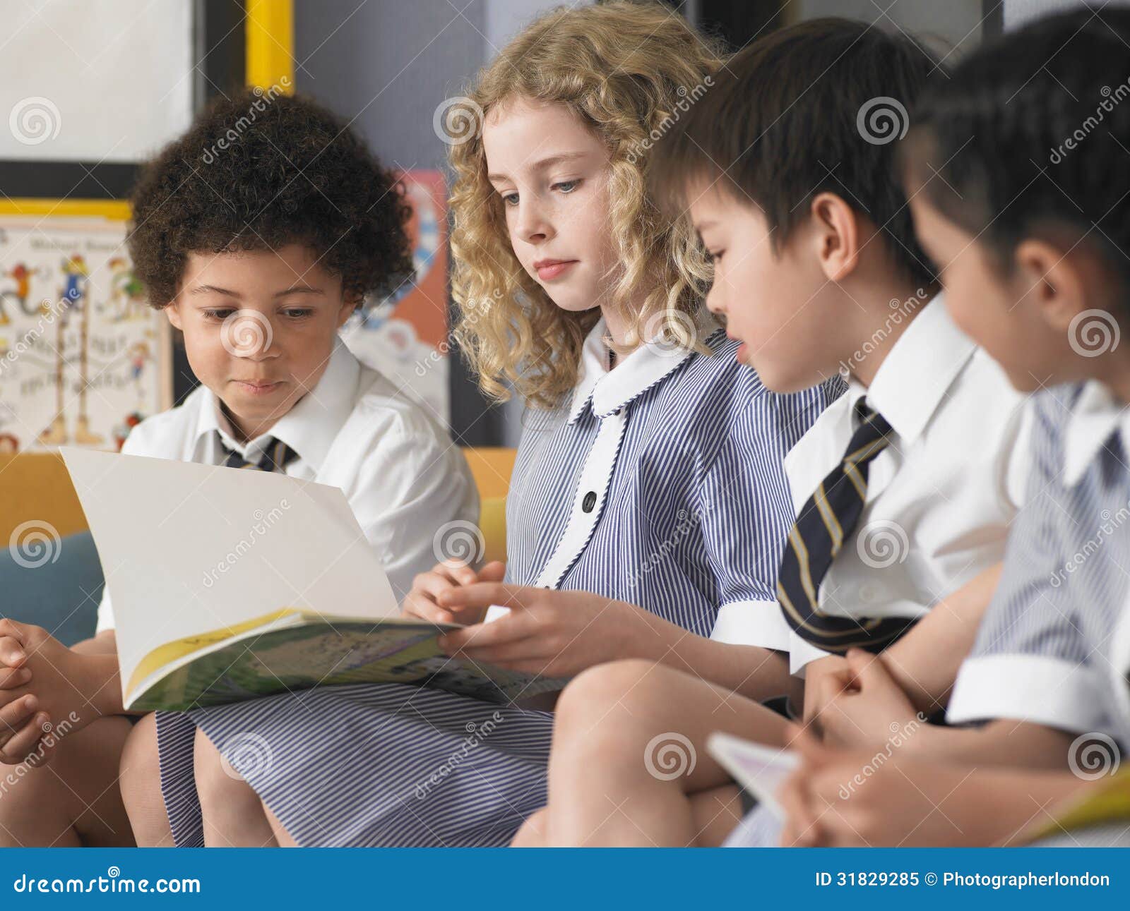 Students Reading Book Sitting in Classroom Stock Image - Image of ...