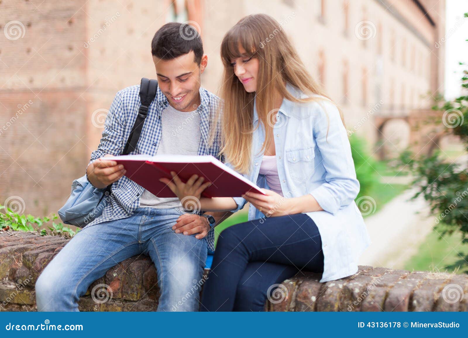 Students Reading a Book Together Stock Photo - Image of reading, teen ...