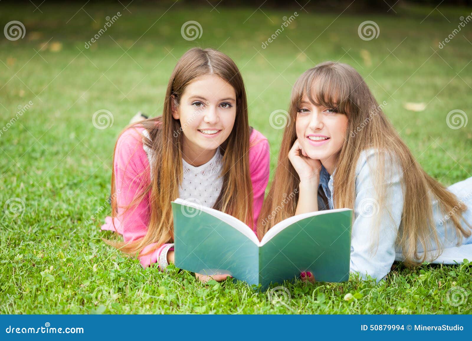 Students reading a book stock photo. Image of college - 50879994