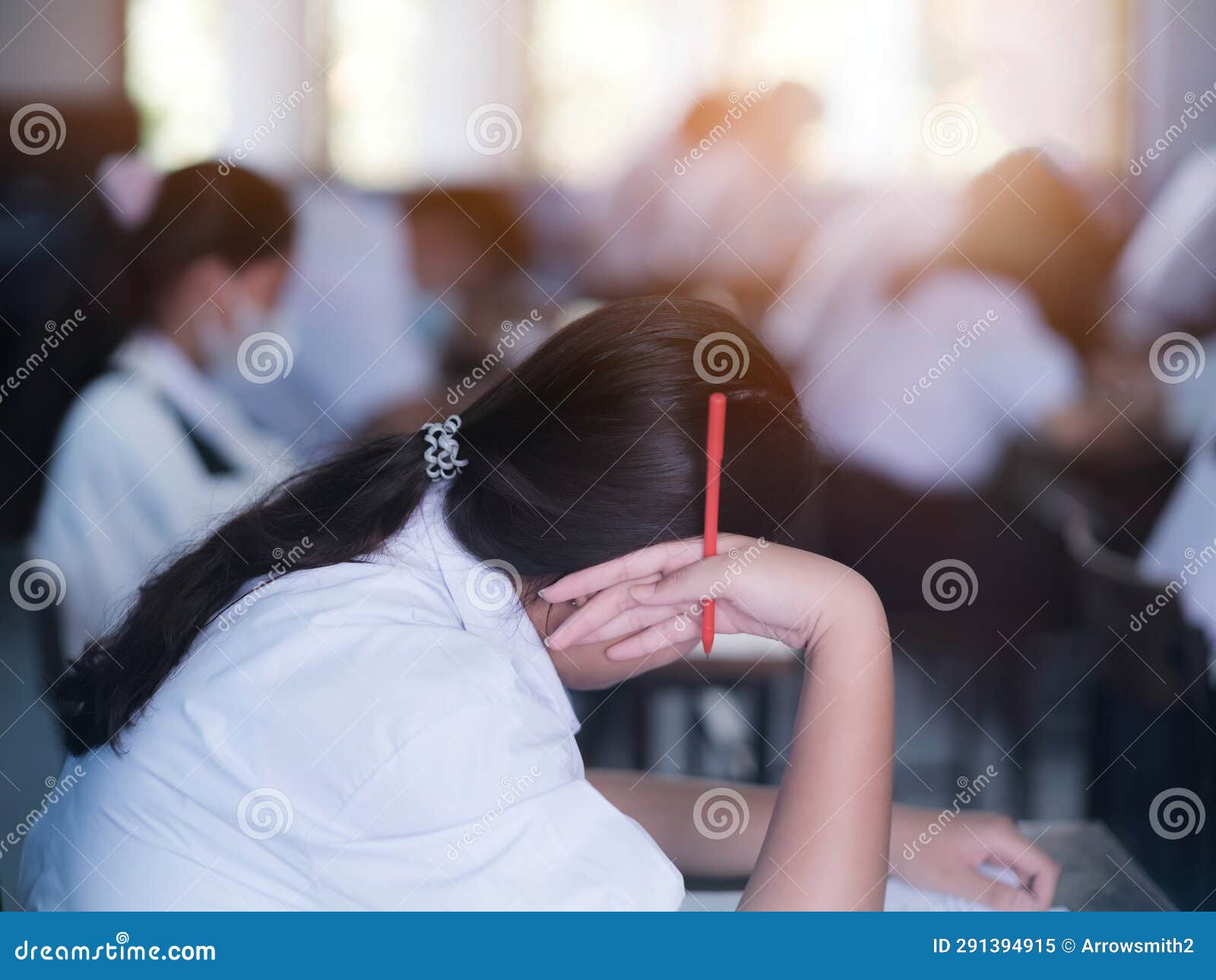 Students Reading Exam Answer Sheets Exercises in Classroom of School ...