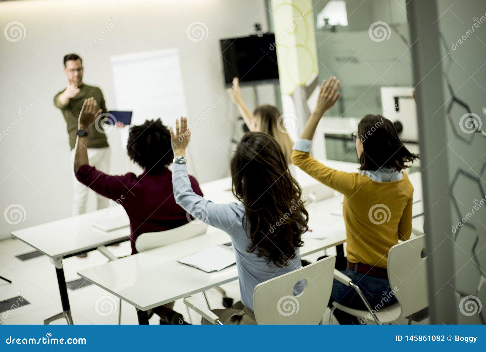 Students Rising Hands To Answer the Question during the Workshop ...