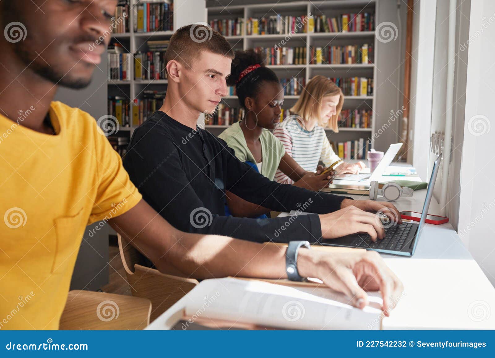Students in Row at College stock photo. Image of female - 227542232
