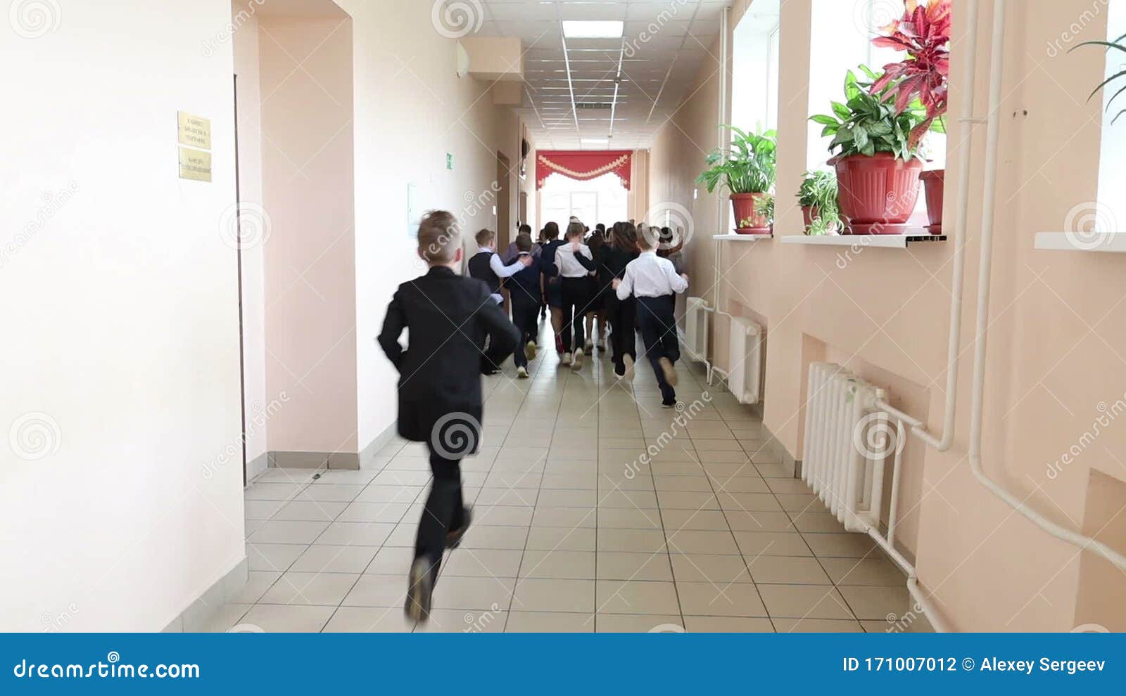 Students Run Down the Corridor in a Crowd during the Break between ...