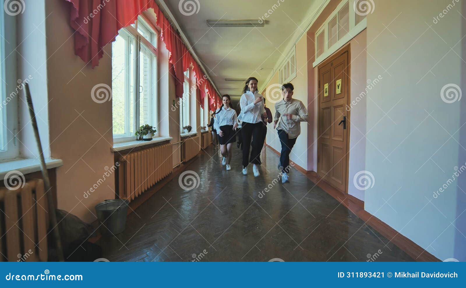 The Students are Running Down the Hallway of the School. Stock Image ...