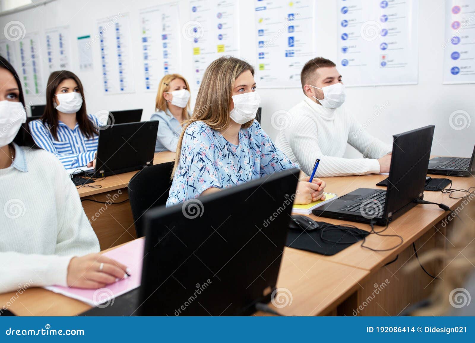 Students with Safety and Protection Masks Sitting in the Classroom ...