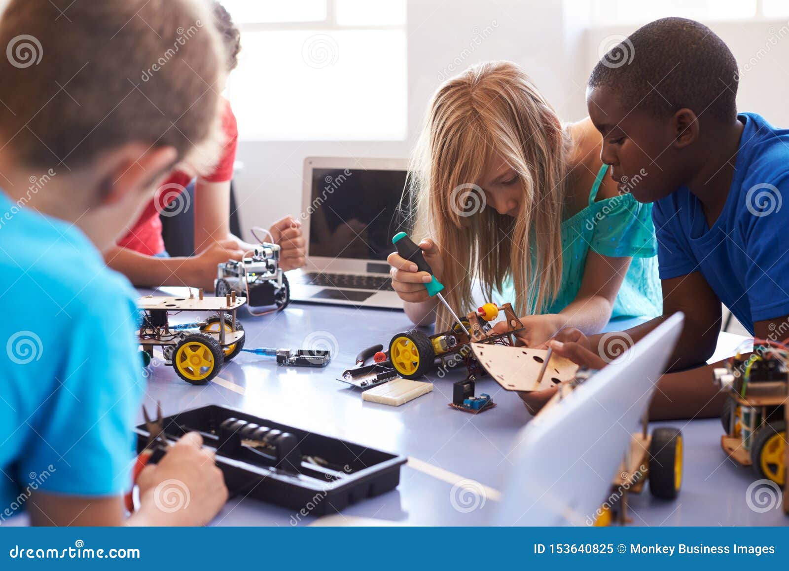 Students in after School Computer Coding Class Building and Learning To Program Robot Vehicle ...