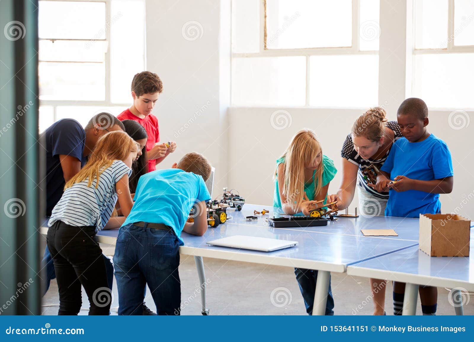 Students in after School Computer Coding Class Building and Learning To Program Robot Vehicle ...
