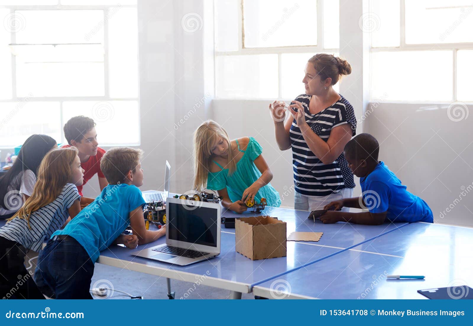 Students in after School Computer Coding Class Building and Learning To Program Robot Vehicle ...