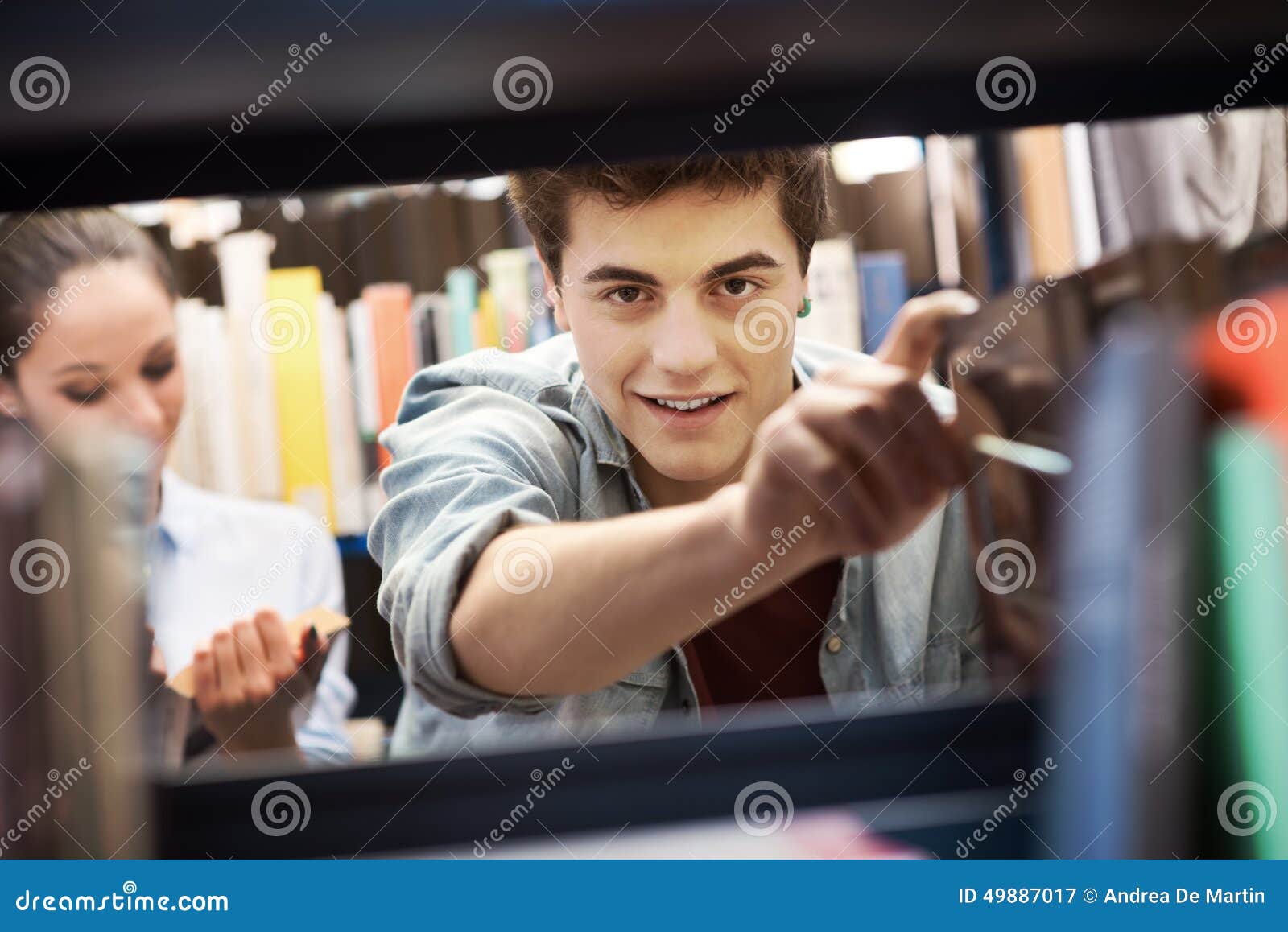 Students Searching for Books at the Library Stock Image - Image of girl ...