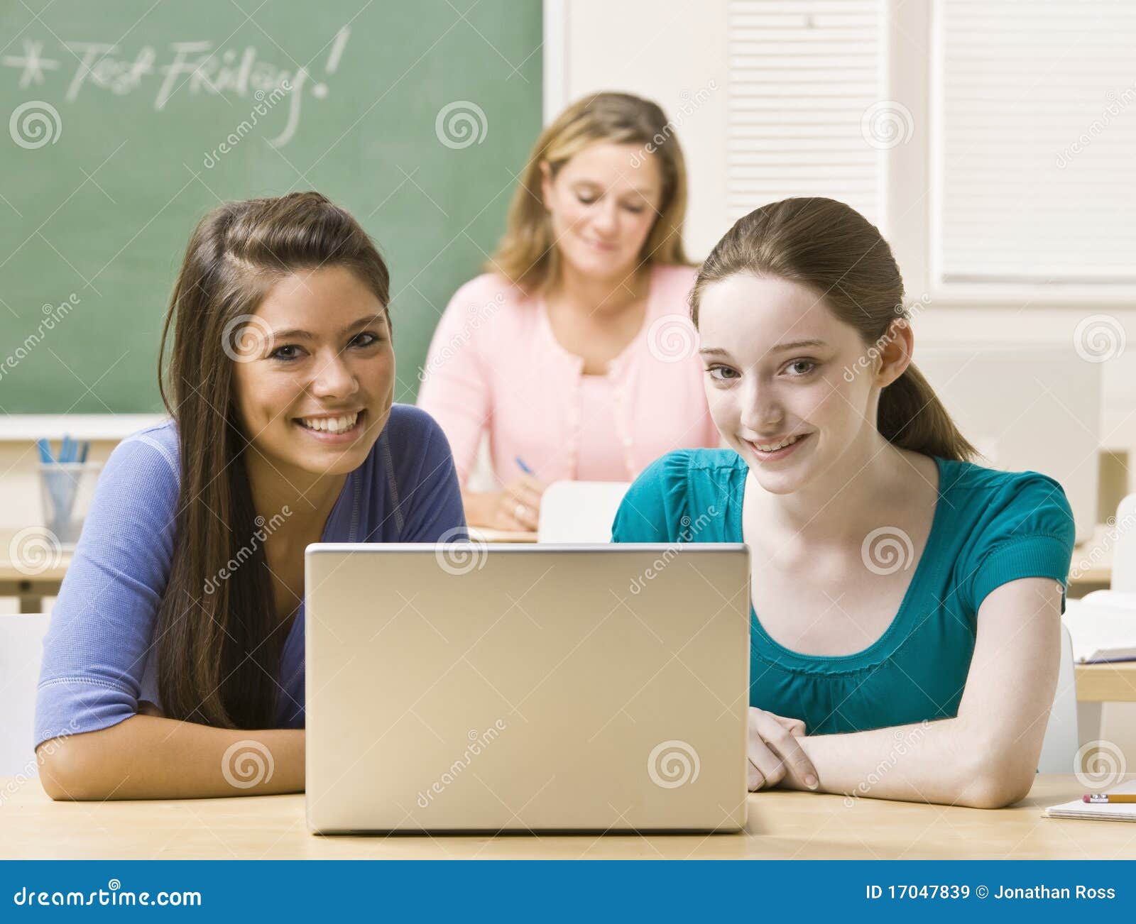 Students Sharing Laptop in Classroom Stock Image - Image of child ...