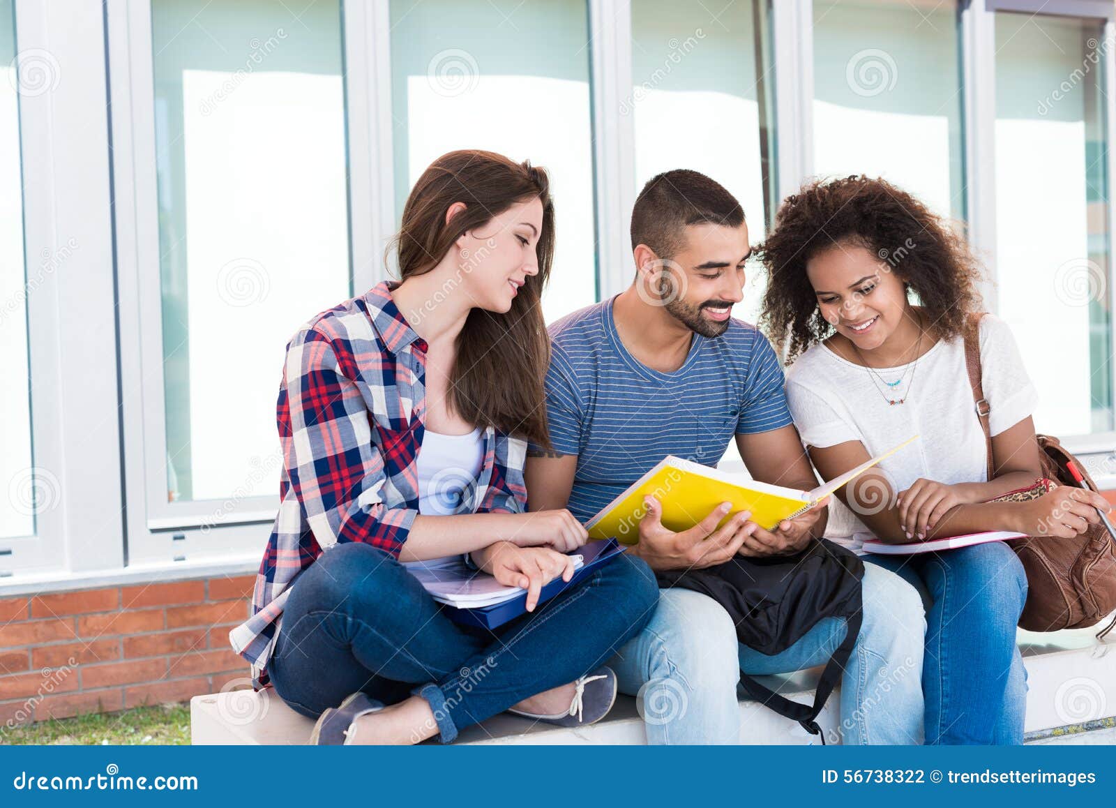 Students sharing notes stock photo. Image of education - 56738322