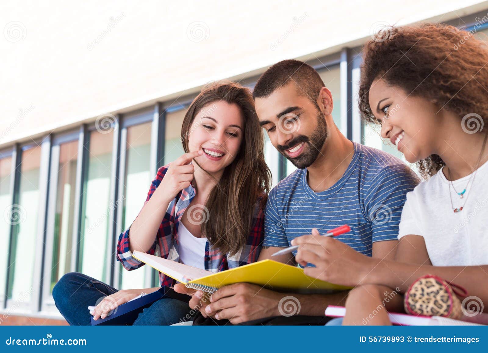 Students sharing notes stock image. Image of education - 56739893
