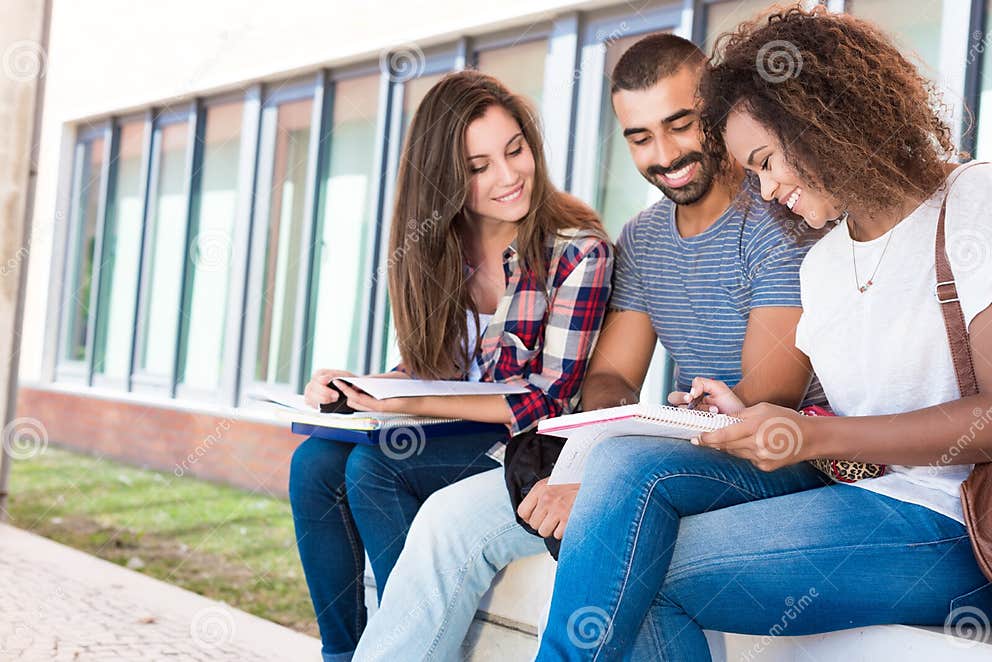 Students sharing notes stock image. Image of ethnic, group - 58529901