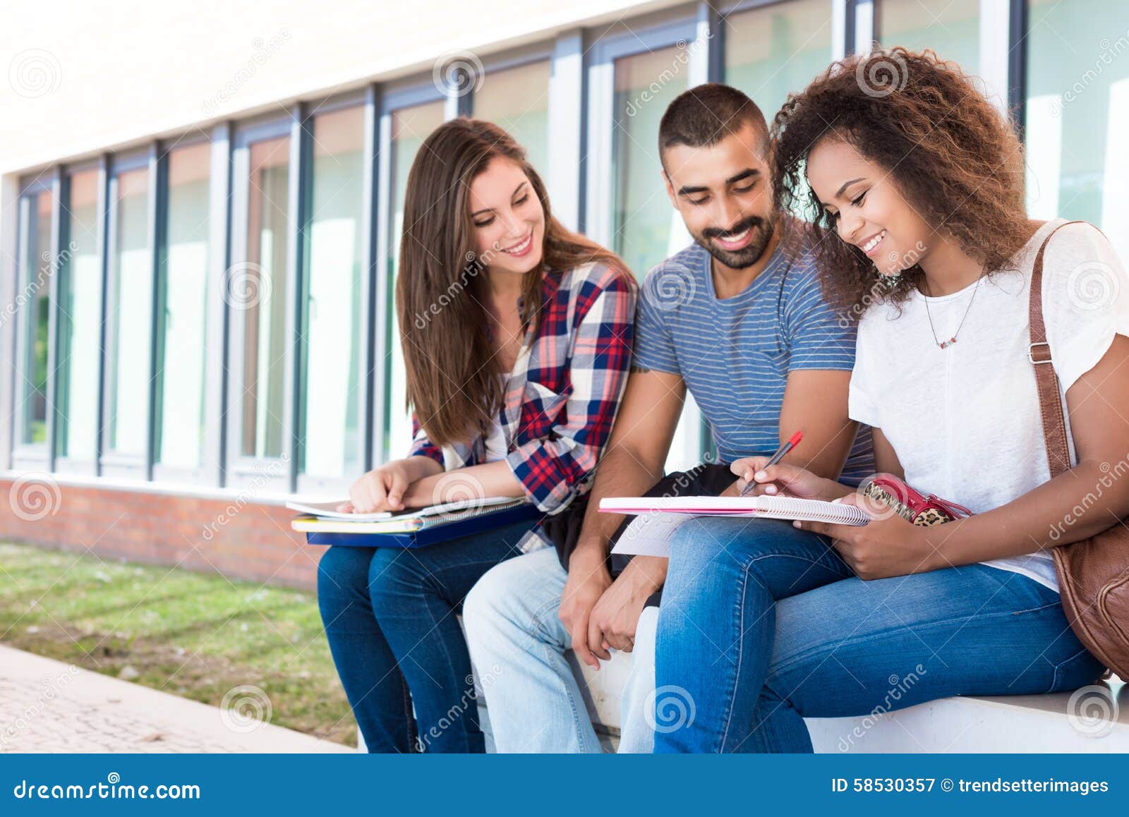 Students sharing notes stock image. Image of group, school - 58530357