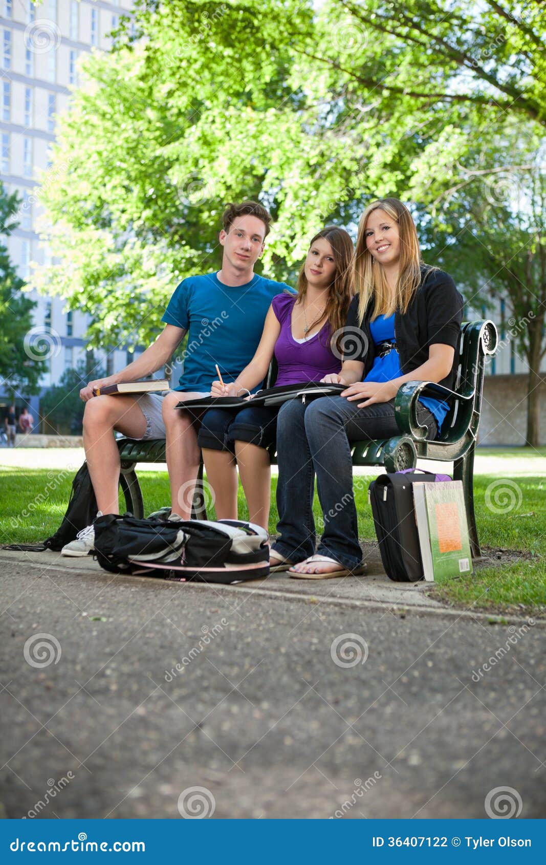 Students Sitting on Campus Bench Stock Photo - Image of beautiful, home ...