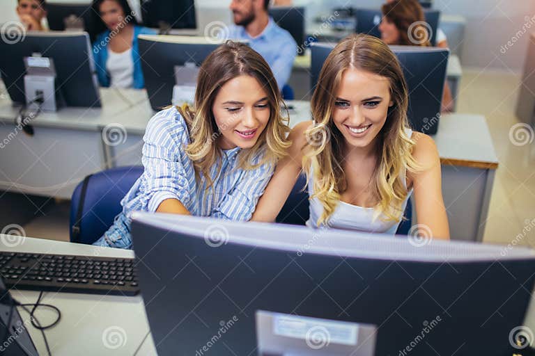 Students Sitting in a Classroom, Using Computers during Class Stock ...