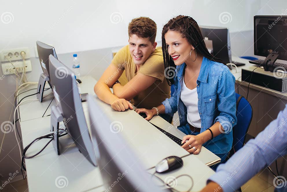 Students Sitting in a Classroom, Using Computers during Class Stock ...