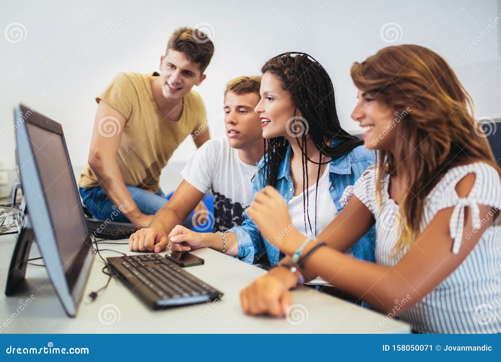 Students Sitting in a Classroom, Using Computers during Class Stock ...