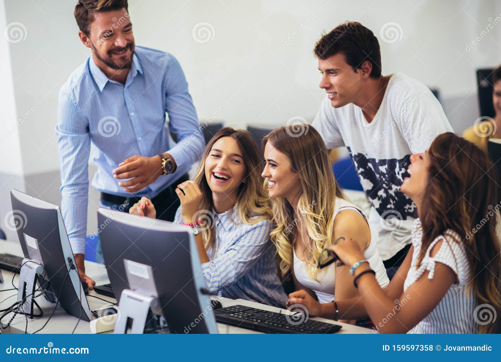 Students Sitting in a Classroom, Using Computers during Class Stock ...