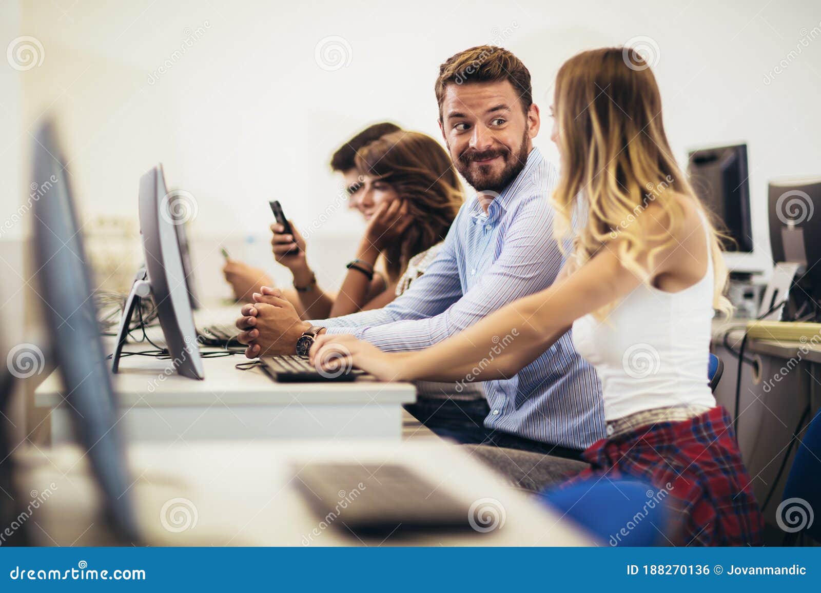 Students Sitting in a Classroom, Using Computers during Class Stock ...