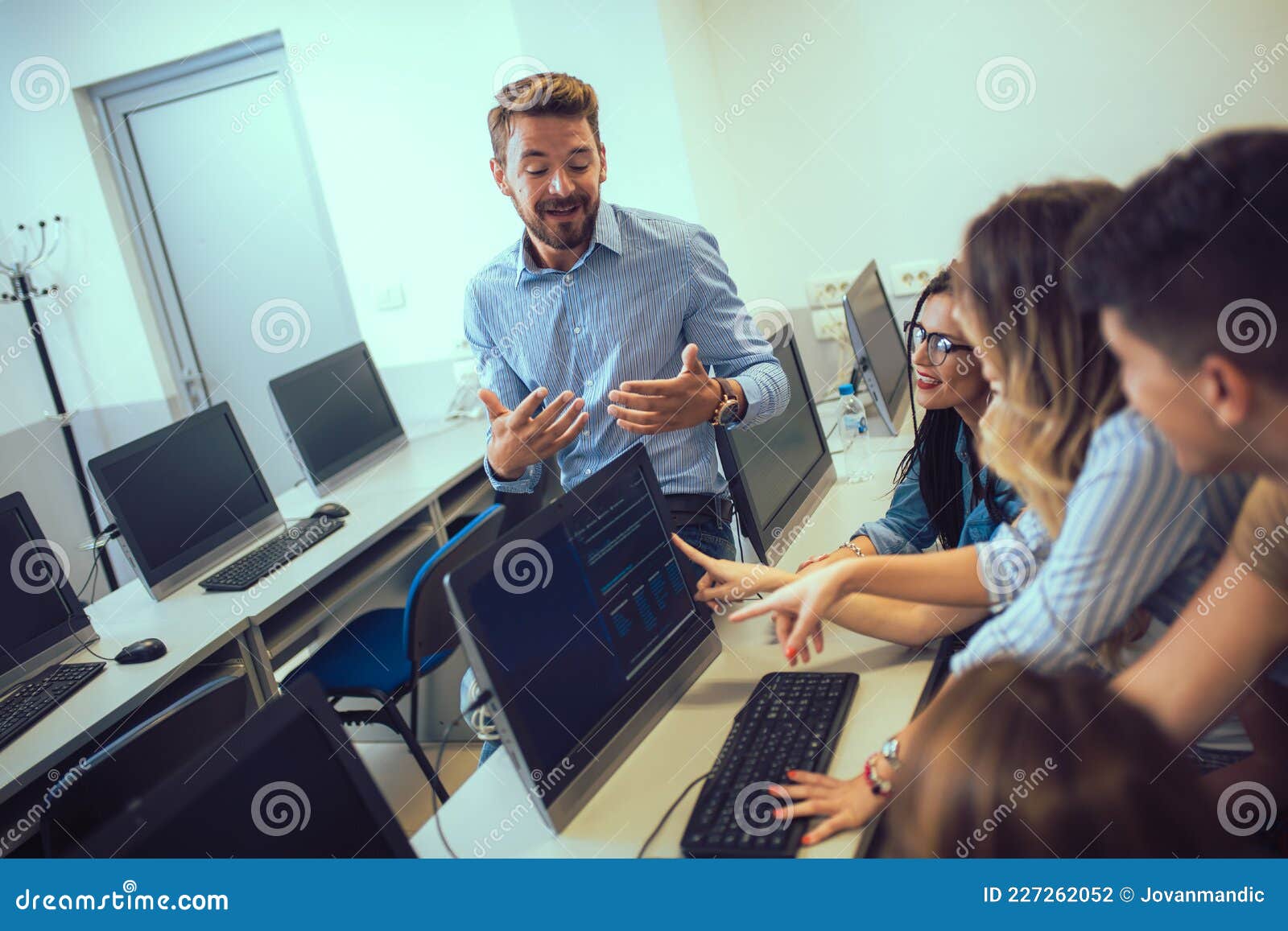 Students Sitting in a Classroom, Using Computers during Class Stock ...