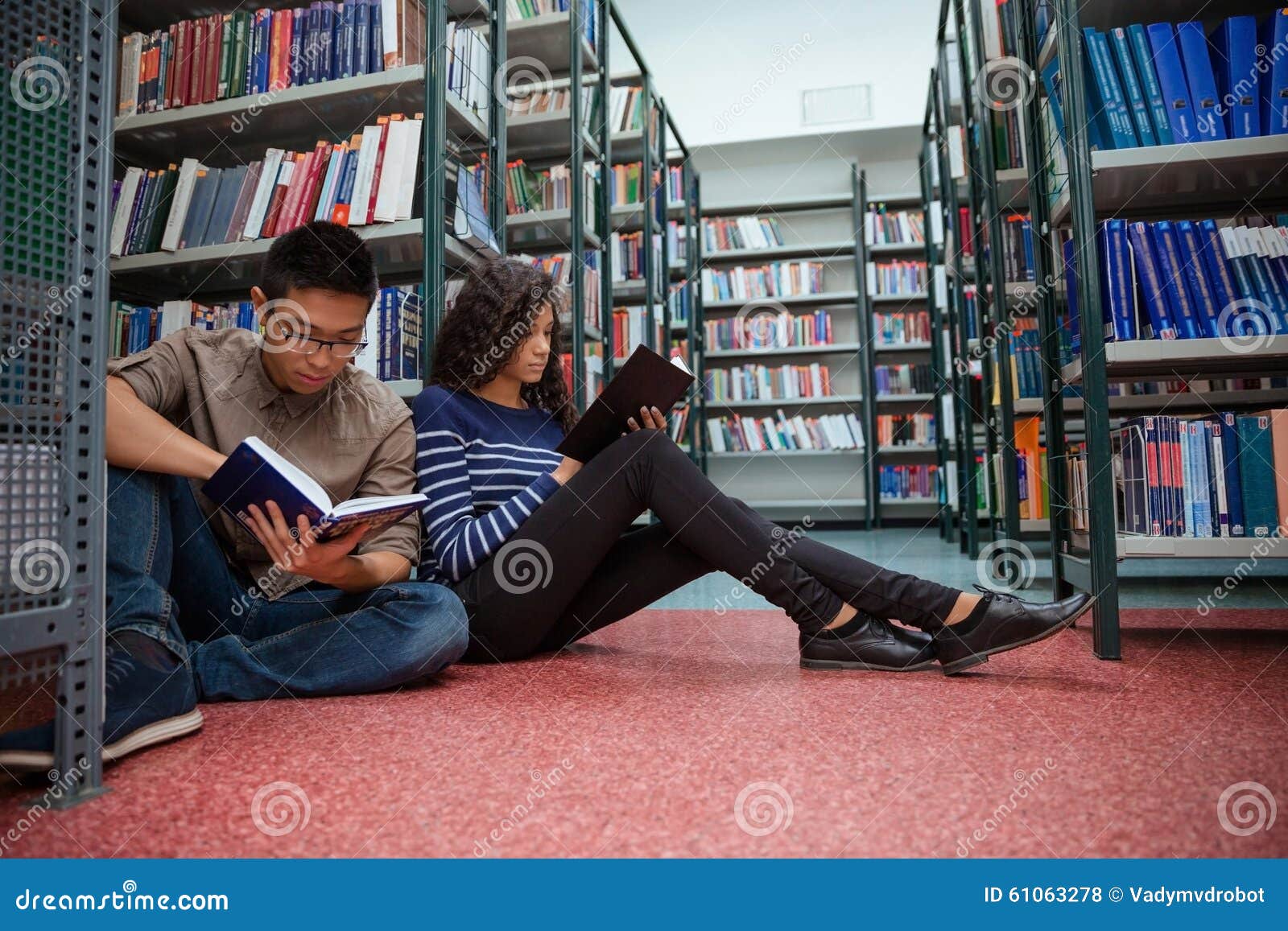 Students Sitting on the Floor and Reading Books Stock Photo - Image of ...