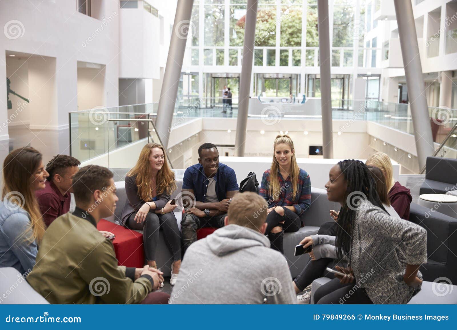 Students Sitting in the Foyer of Modern University Building Stock Photo ...