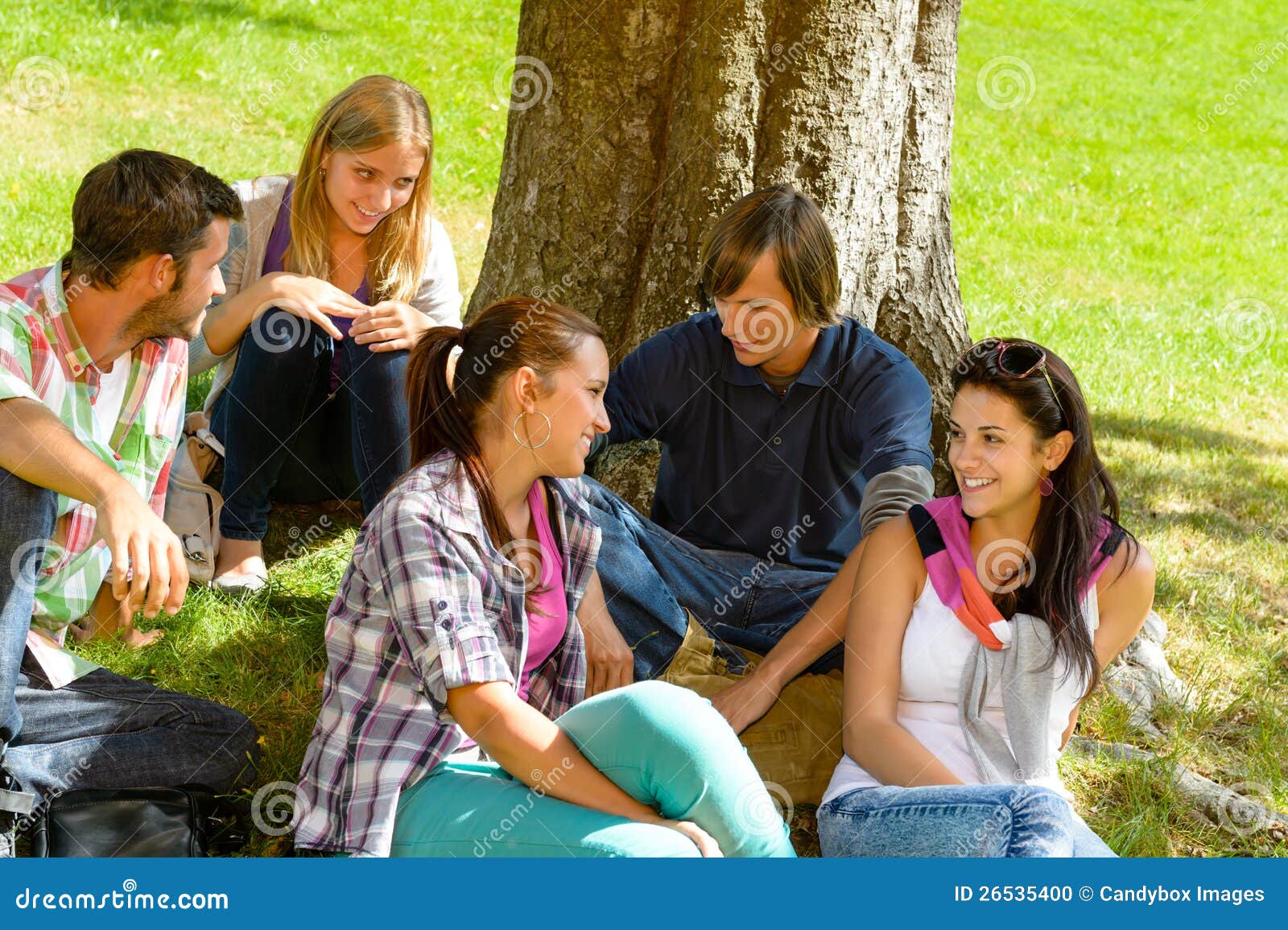 Students Sitting in Park Talking Smiling Teens Stock Photo - Image of ...
