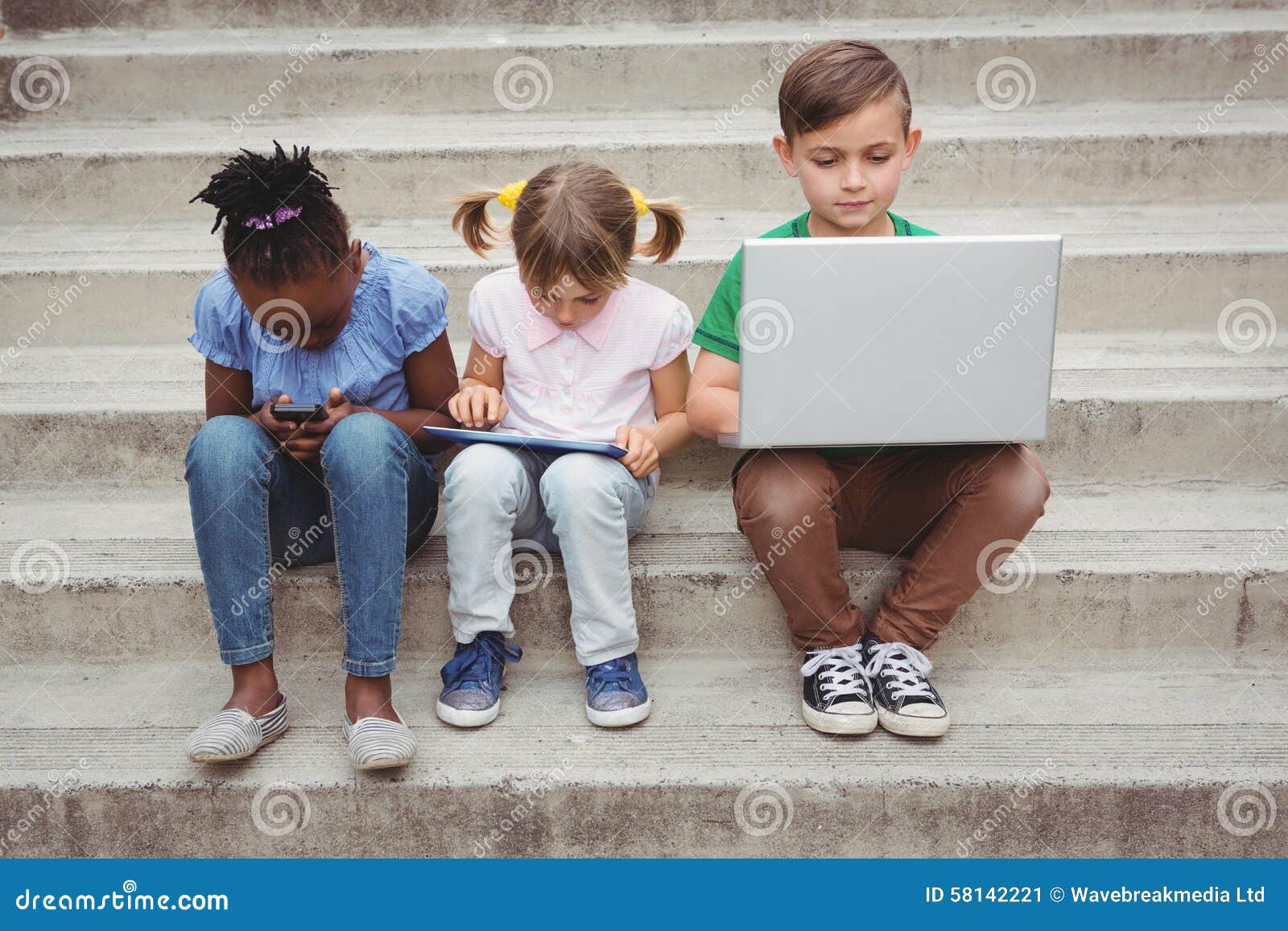 Students Sitting on Steps and Using a Tablet Stock Image - Image of ...