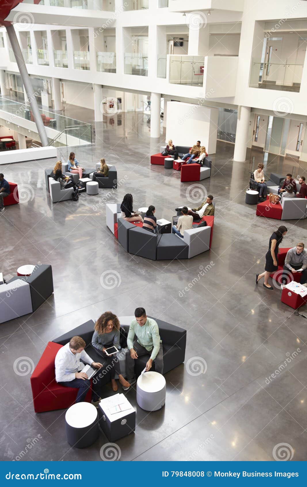 Students Sitting in University Atrium, Vertical Stock Photo - Image of ...