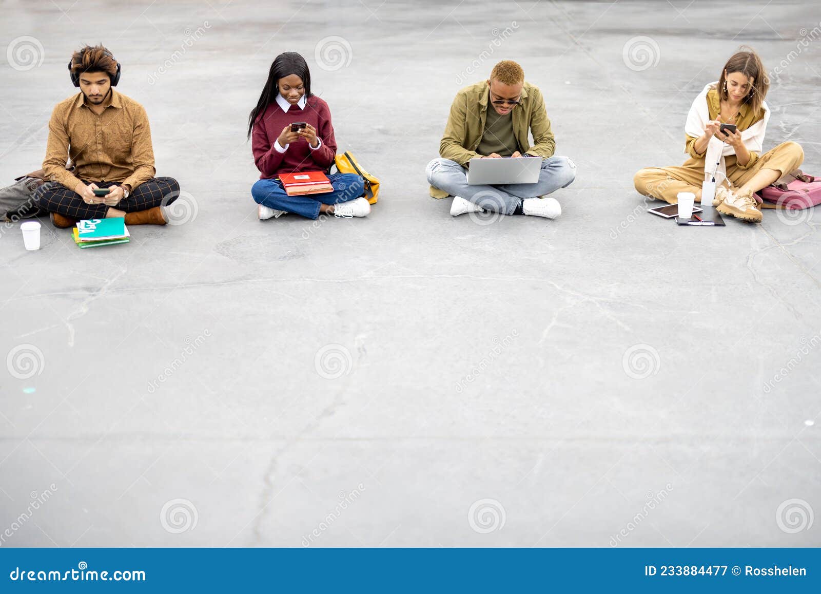 Students Sitting and Using Gadgets on Asphalt Stock Image - Image of ...