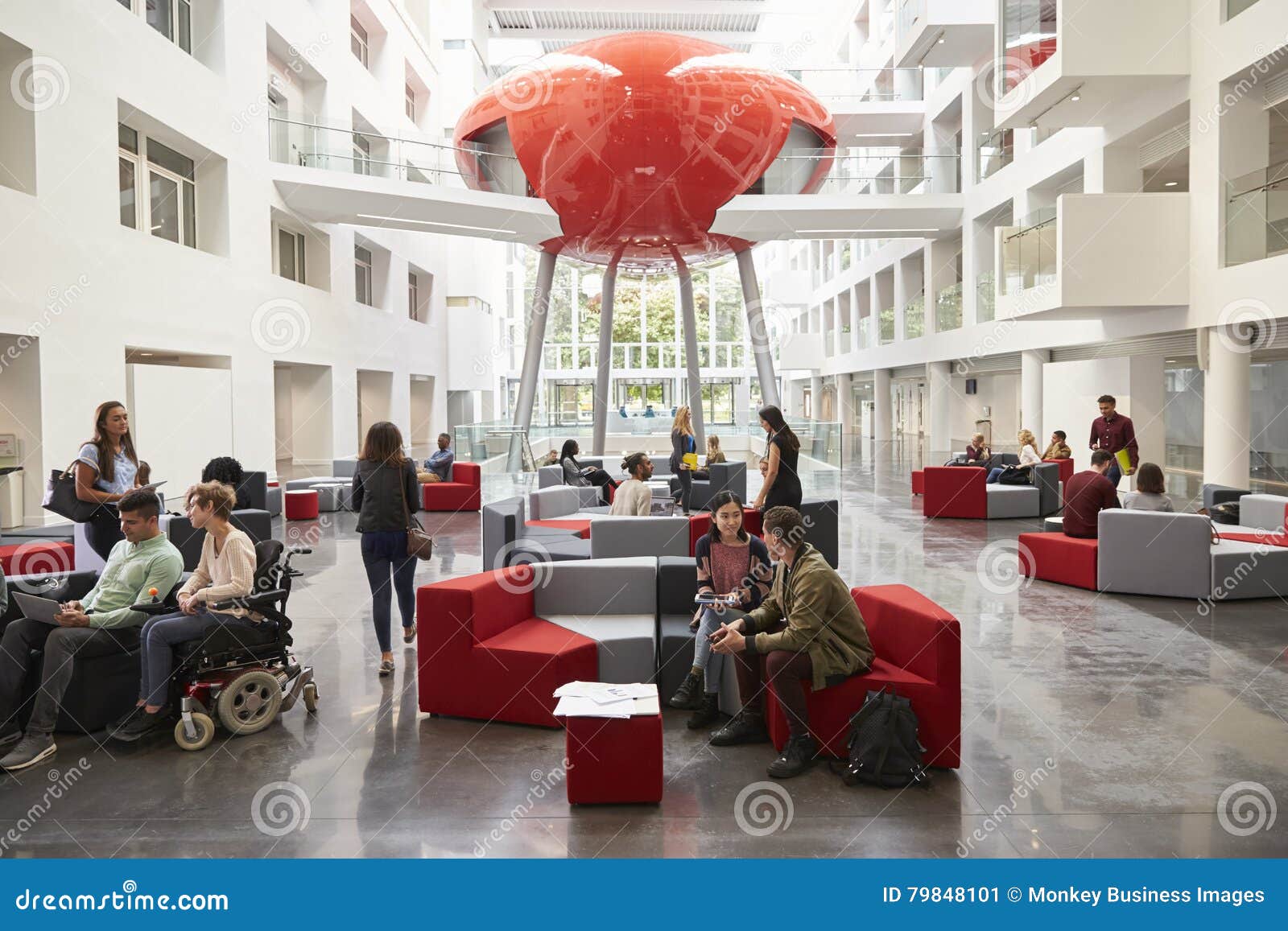 Students Socialising in the Modern Lobby of Their University Stock ...
