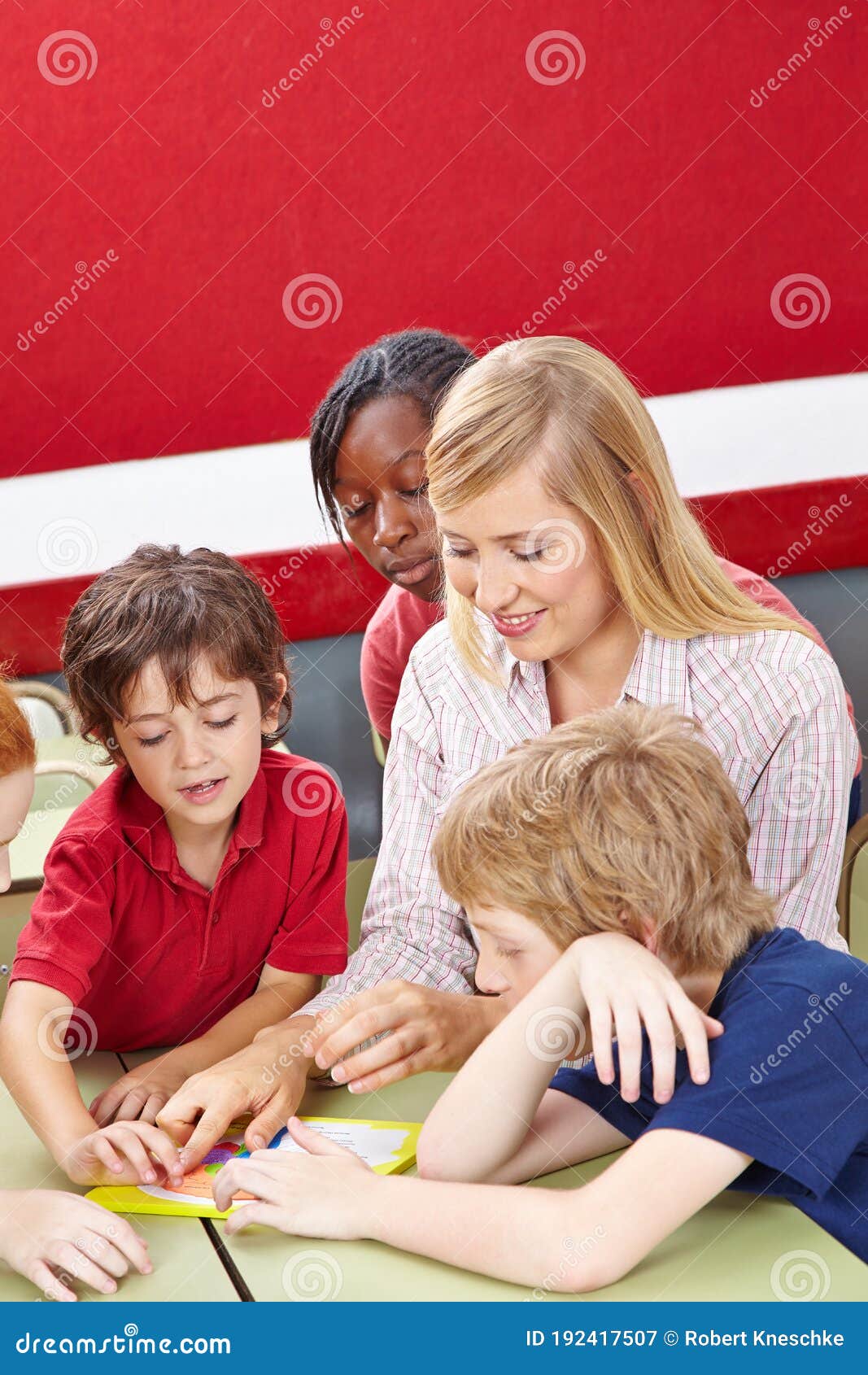 Students Solve Puzzle with Teacher at School Stock Image - Image of ...