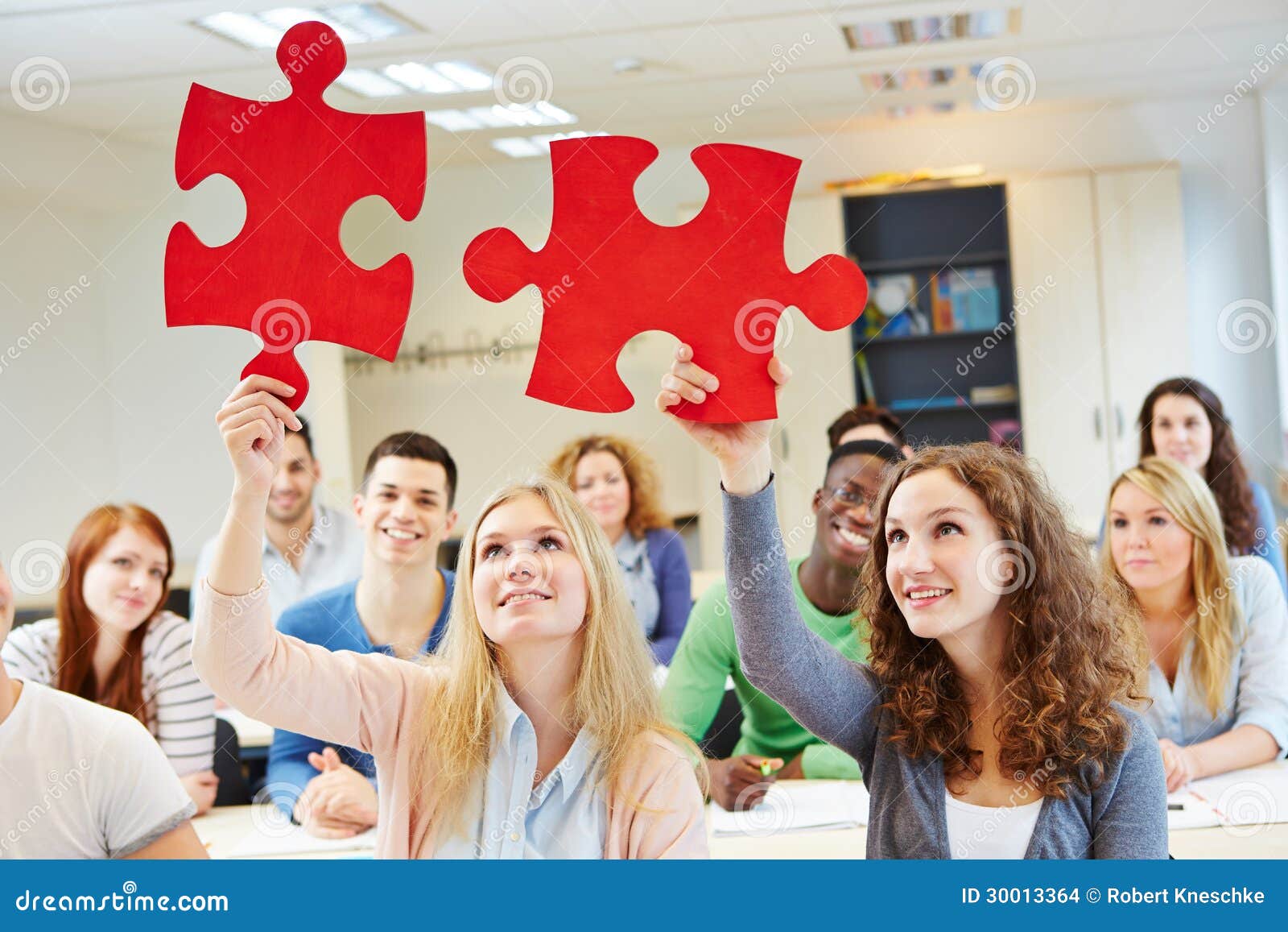 Students Solving Jigsaw Puzzle As a Team Stock Photo - Image of pupil ...