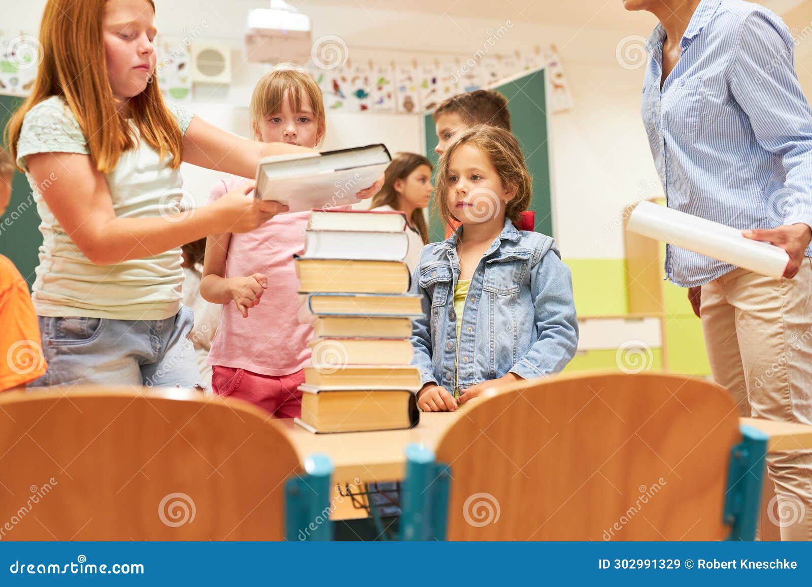 Students Stacking Books during Activity at School Stock Image - Image ...