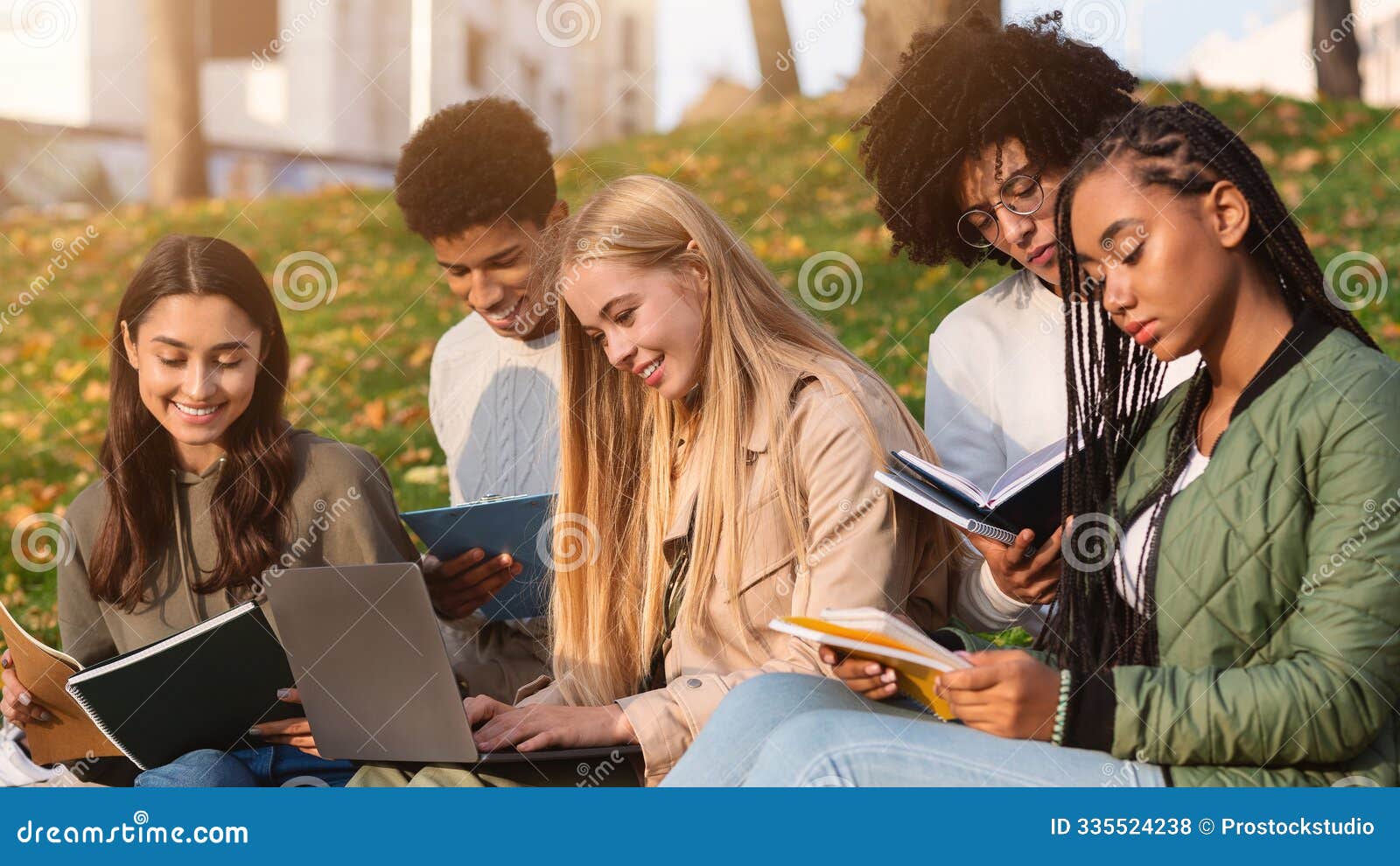 Students Studying Hard, Sitting on the Ground at Park Stock Photo ...