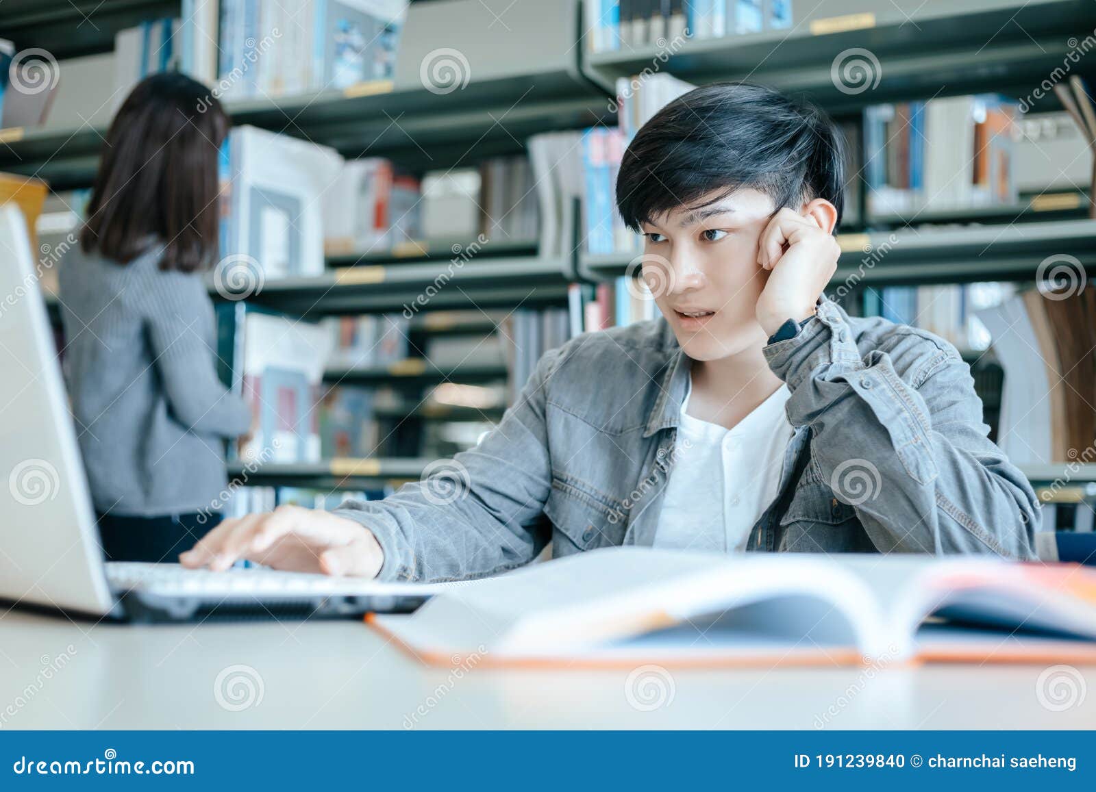 Students Studying in the Library with Laptop at the University ...